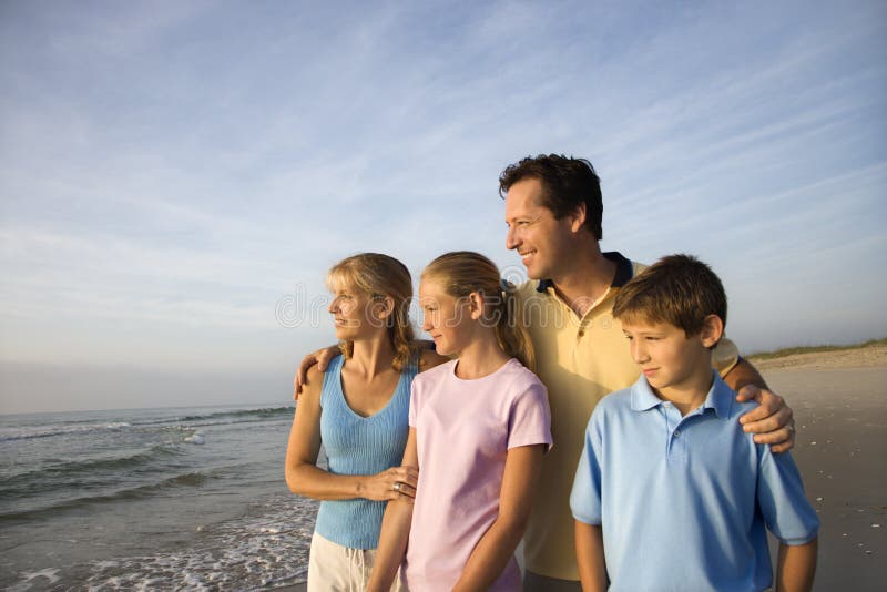 Smiling family on beach. stock photo. Image of girl, portrait - 2038224