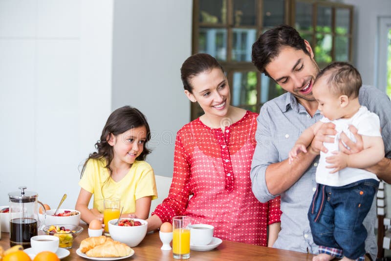 Smiling Family at Breakfast Table Stock Image - Image of bonding ...
