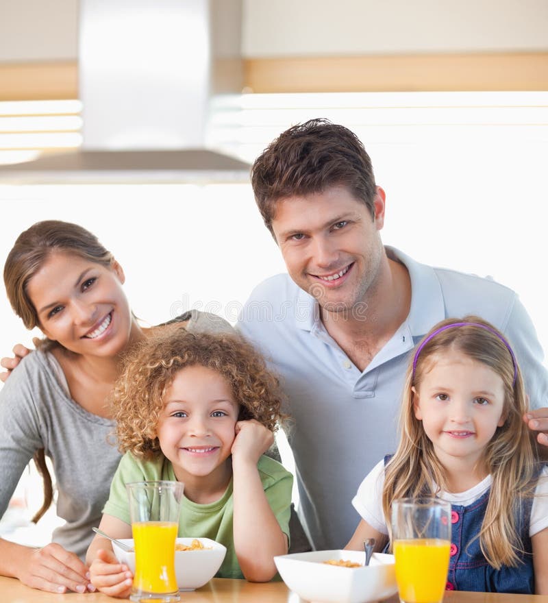 Smiling Family Having Breakfast Stock Photo - Image of childhood, drink ...