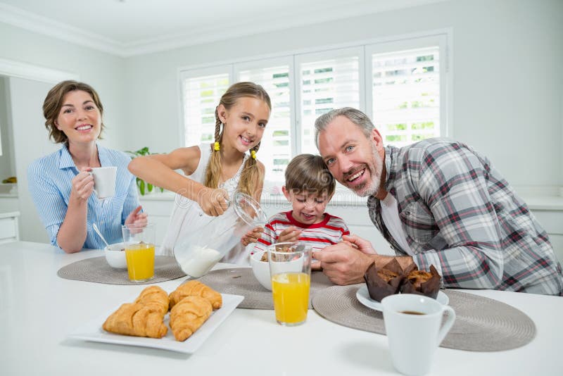 Smiling Family Having Breakfast in the Kitchen Stock Image - Image of ...