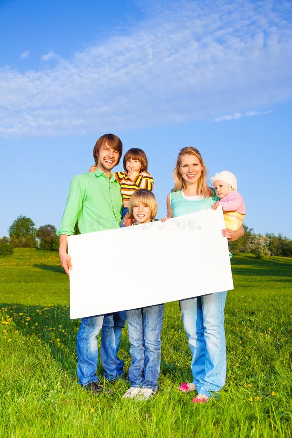Smiling Family Holds White Square Paper Format Stock Photo - Image of ...