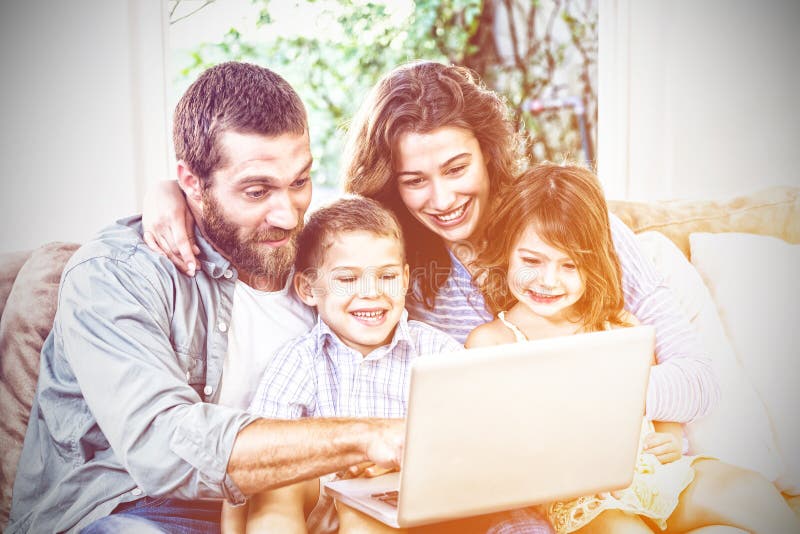 Smiling family with laptop stock image. Image of children - 135800187