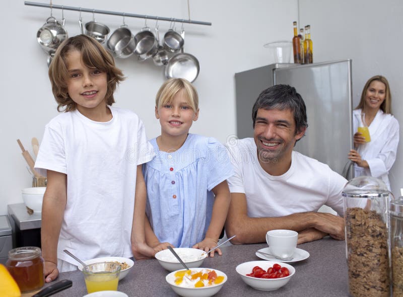 Smiling Family Preparing Breakfast Stock Photo - Image of cheerful ...