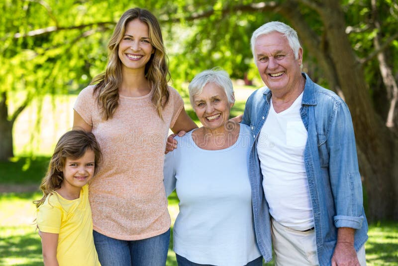 Smiling family standing stock photo. Image of happy, garden - 67756478