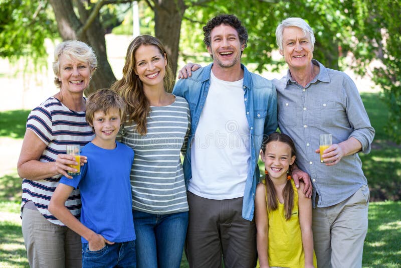 Smiling family standing stock image. Image of granddaughter - 67757817