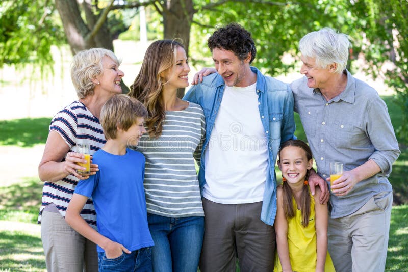Smiling family standing stock photo. Image of mature - 67757820