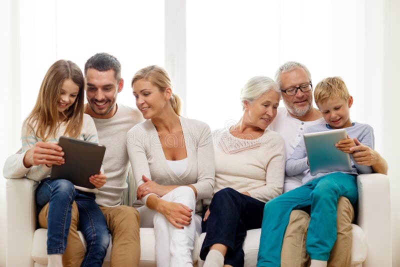 Smiling Family with Tablet Pc at Home Stock Photo - Image of ...