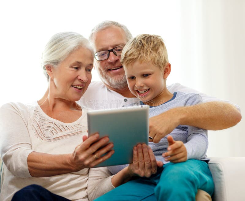 Smiling Family with Tablet Pc at Home Stock Image - Image of ...