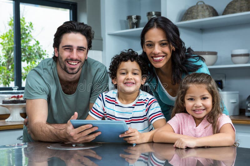 Family Using a Laptop on the Sofa Stock Image - Image of adult ...