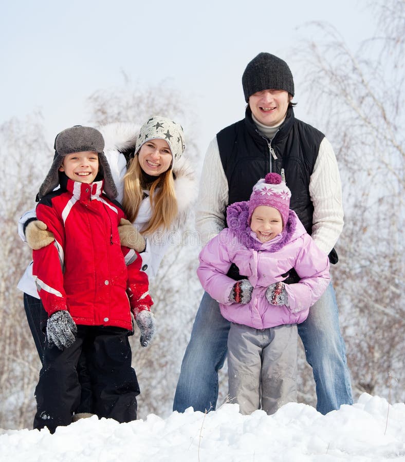 Young Family Having Fun in Snowy Landscape Stock Photo - Image of ...