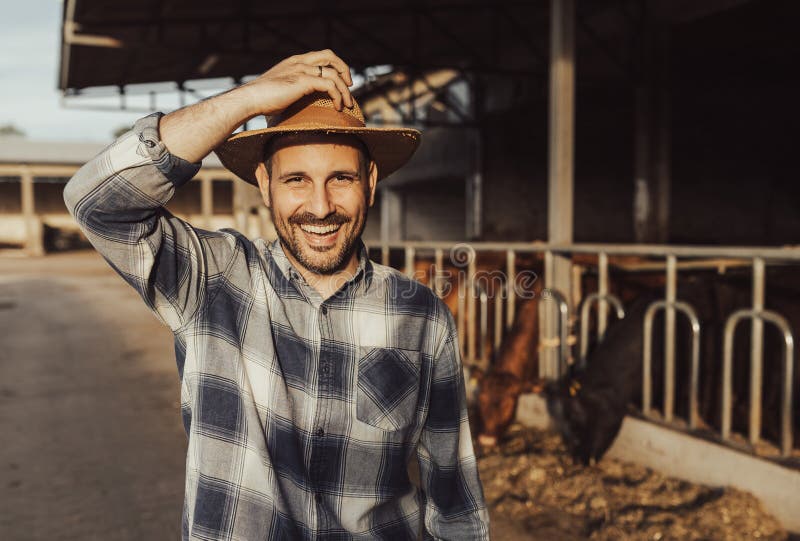 Smiling Farmer with Hat on Cattle Ranch Stock Image - Image of worker ...