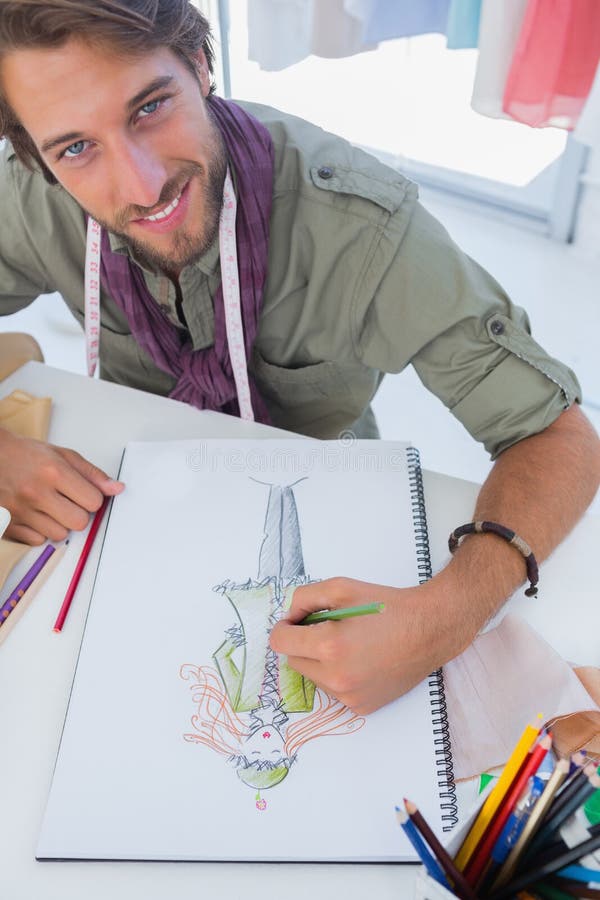 Smiling Fashion Designer Drawing a Coat Stock Image - Image of ...
