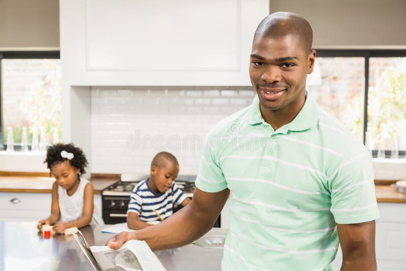 Smiling Father Reading Newspaper Stock Image - Image of homey, female ...