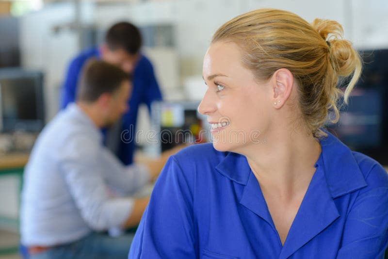 Smiling Female Apprentice in Profile Stock Image - Image of attractive ...