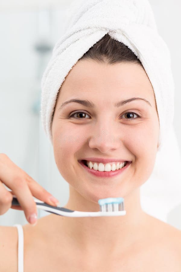 Smiling Female Brushing Teeth Stock Image - Image of shower, smile ...