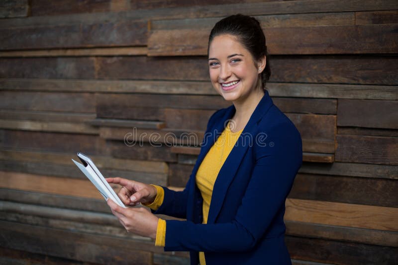 Smiling Female Business Executive Using Digital Tablet Stock Photo ...