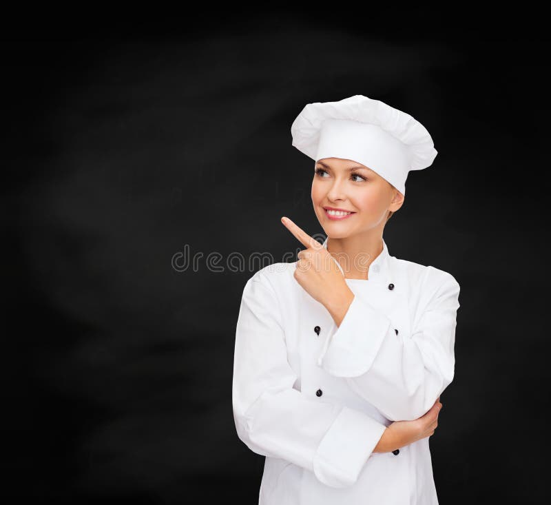Smiling Female Chef Pointing Finger To Something Stock Image - Image of ...