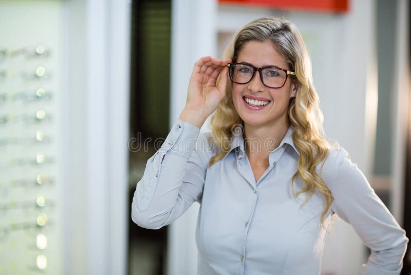 Smiling Female Customer Trying Spectacles Stock Image - Image of casual ...