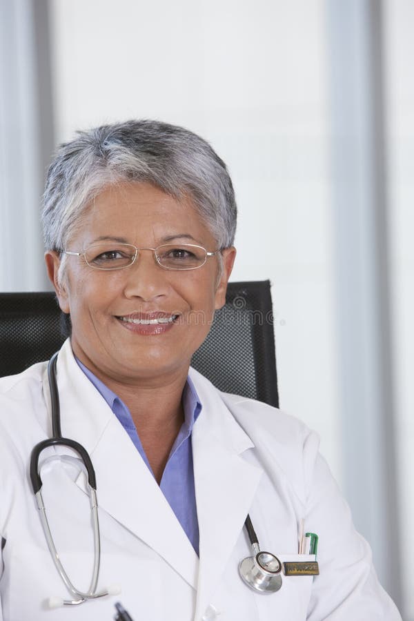 Smiling female doctor stock image. Image of mature, reliability - 10473239