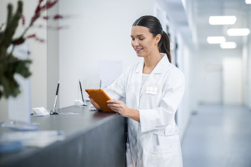 Smiling Female Doctor in the Clinic Reception Stock Image - Image of ...