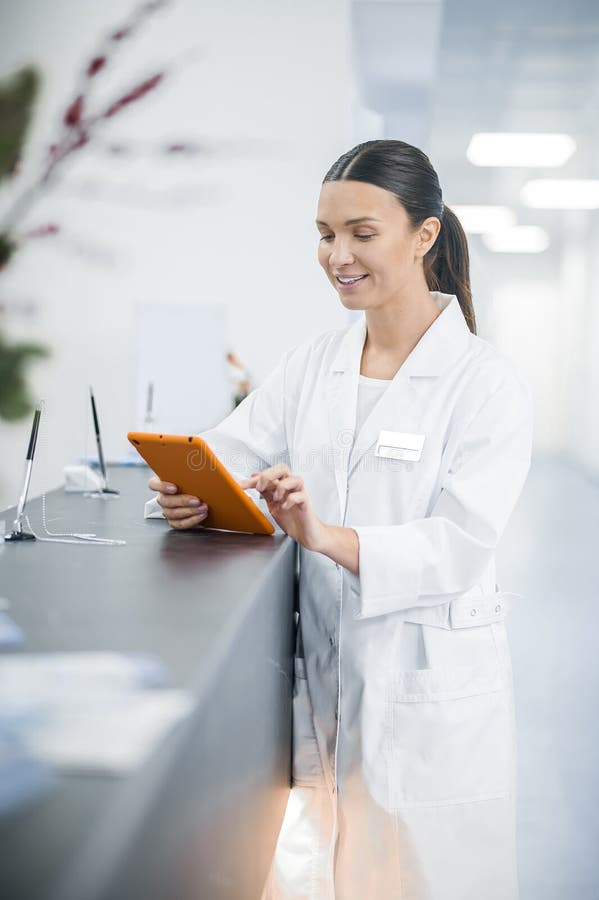 Smiling Female Doctor in the Clinic Reception Stock Image - Image of ...