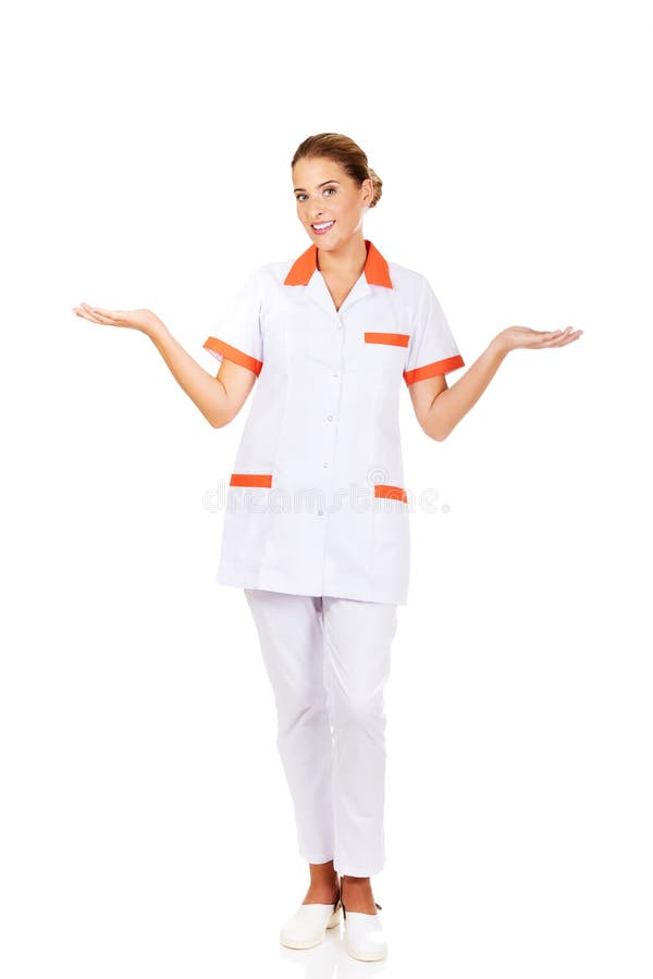 Smiling Female Doctor or Nurse Pointing at Something Stock Photo ...