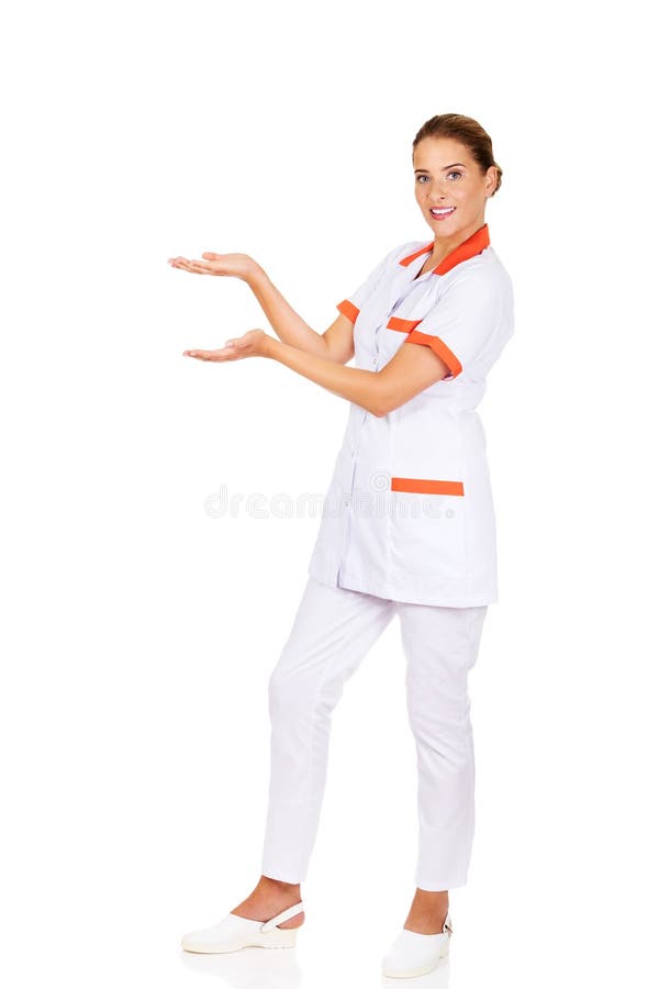 Smiling Female Doctor or Nurse Pointing at Something Stock Image ...