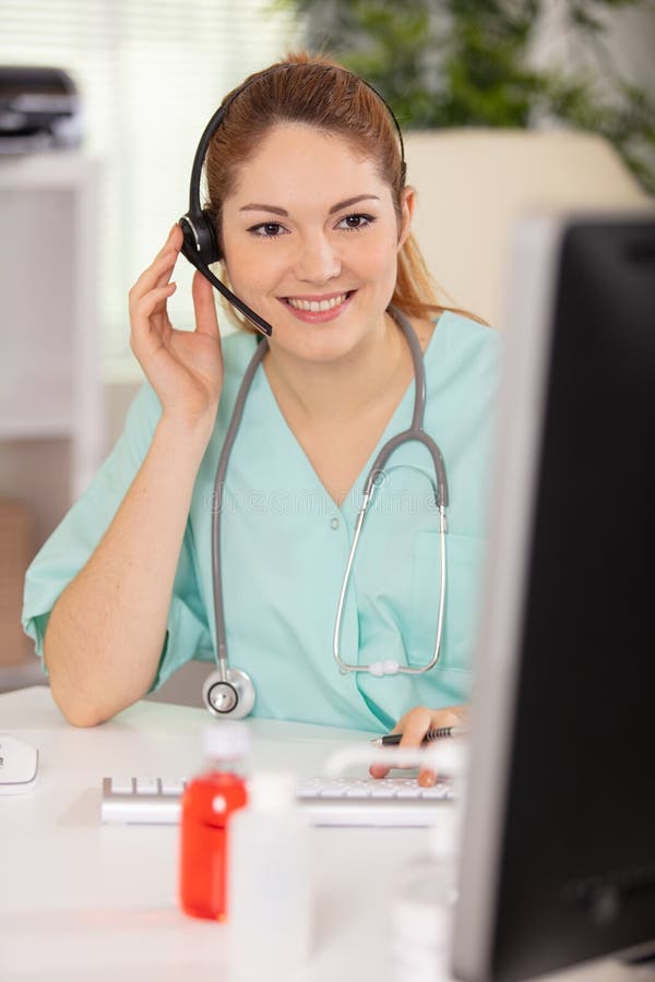 Smiling Female Doctor Working on Line with Laptop Stock Photo - Image ...