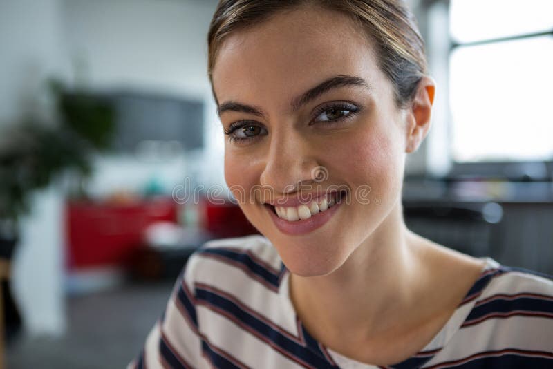 Smiling Female Executive at Creative Office Stock Image - Image of ...