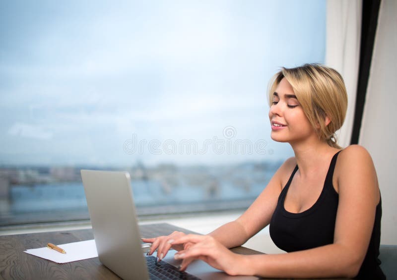 Charming Woman Website Content Creator Working on Modern Laptop ...