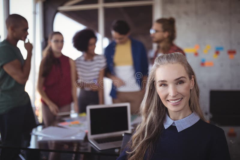Smiling Female Manager with Creative Team in Office Stock Image - Image ...