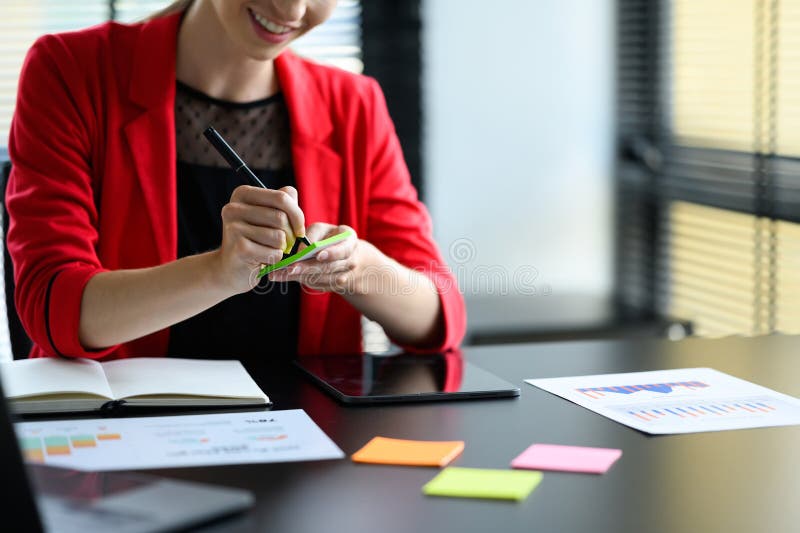 Smiling Female Manager Writing Idea for Startup Project or Reminder ...