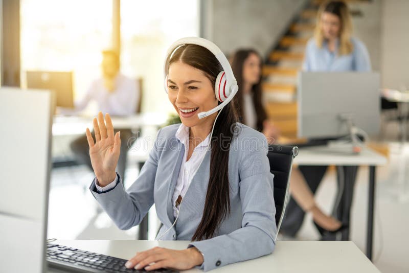 Smiling Female Operator Agent with Headset Waving Hand during Video ...