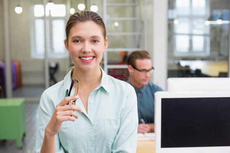 Smiling Female Photo Editor in Office Stock Photo - Image of office ...