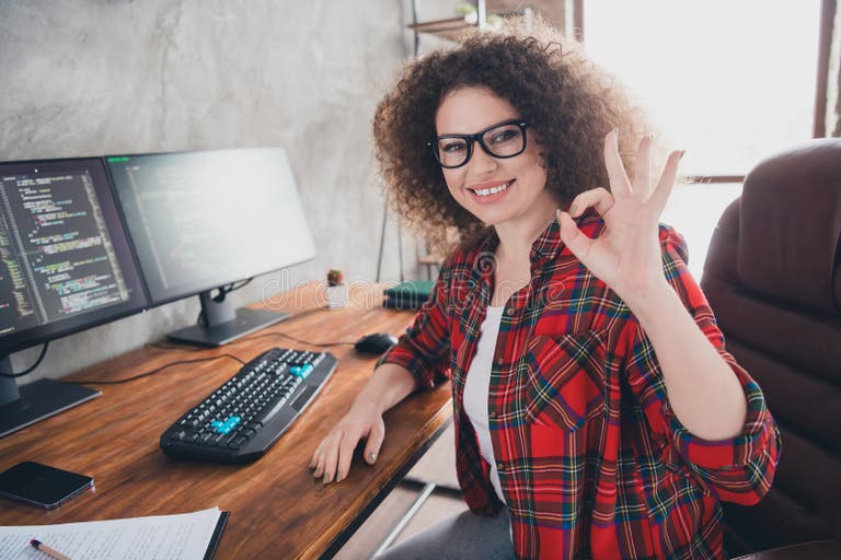 Smiling Female Programmer Gestures in a Comfortable Home Office with ...