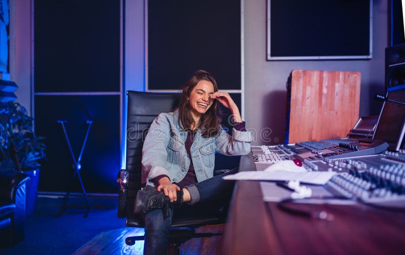 Smiling Female Sound Technician in Recording Studio Stock Image - Image ...
