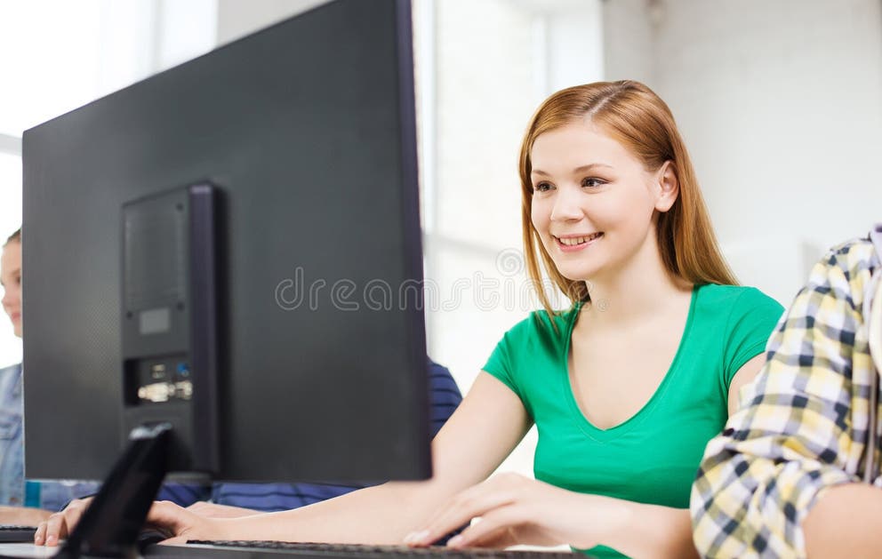 Smiling Female Student in Computer Class Stock Image - Image of ...