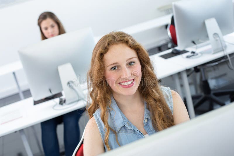 Smiling Female Student in Computer Class Stock Image - Image of ...