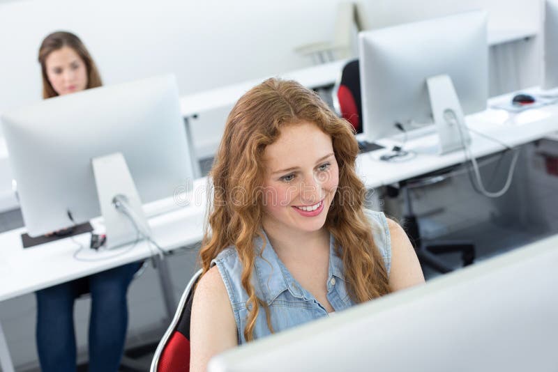 Smiling Female Student in Computer Class Stock Photo - Image of happy ...