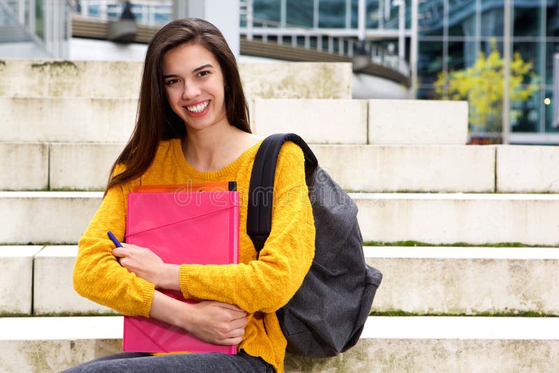 Smiling Female Student Holding Notebook and Pen Stock Image - Image of ...