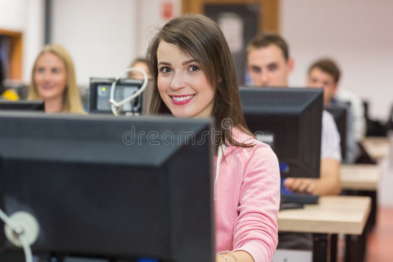 Smiling Female Student with Others in the Computer Room Stock Photo ...