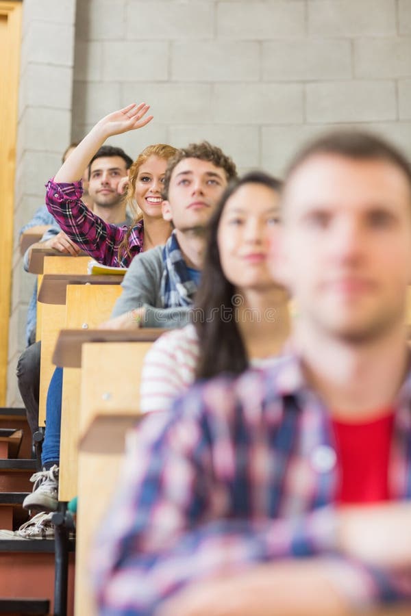 Smiling Female Student Raising Hand in Classroom Stock Photo - Image of ...