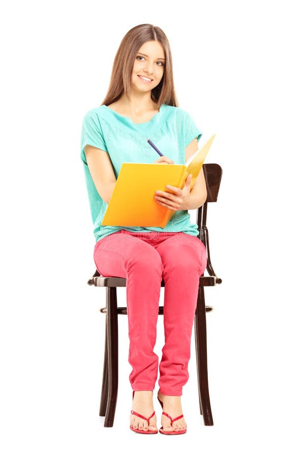 Smiling Female Student Sitting on a Chair and Writing Notes Stock Image ...