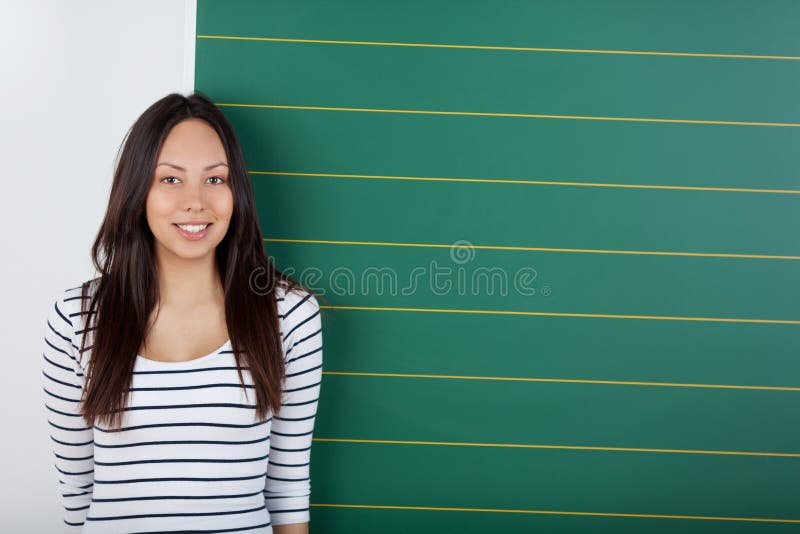 Smiling Female Student Standing beside Board Stock Image - Image of ...