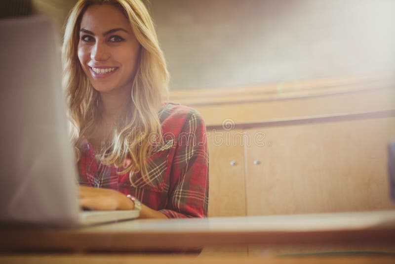 Smiling Female Student Using Laptop Stock Image - Image of homework ...