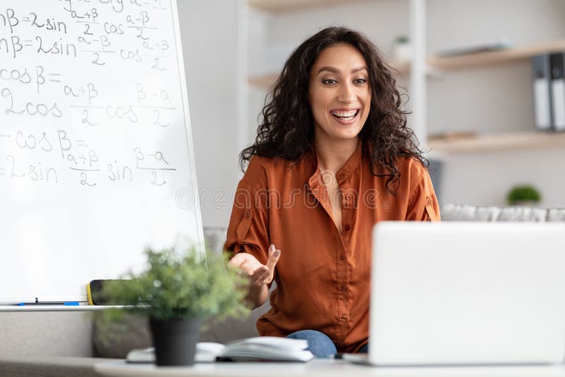 Smiling Female Teacher Explaining Trigonometric Functions To Students ...