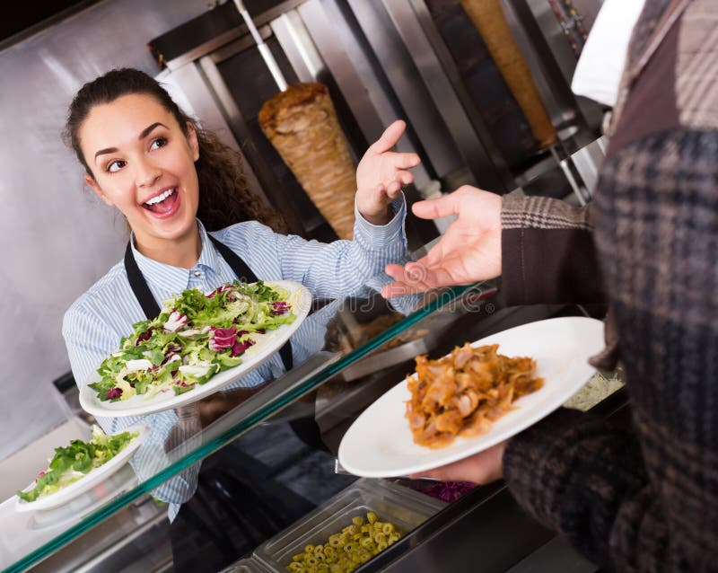 Smiling Female Worker Serving Customer Stock Photo - Image of arab ...