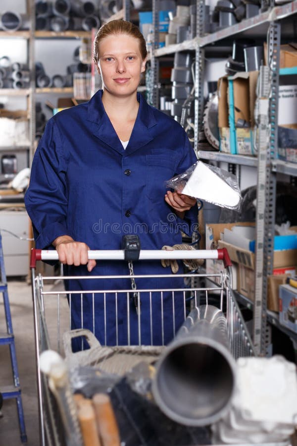 Smiling Female Worker in Uniform with Basket Purchasing Tools in Build ...