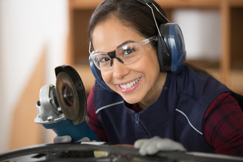 Female Using Angle Grinder Stock Photos - Free & Royalty-Free Stock ...