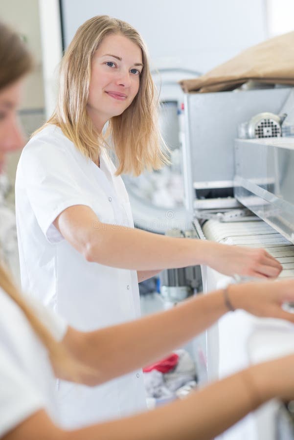 Smiling Female Worker in White Coats during Working Process Stock Image ...